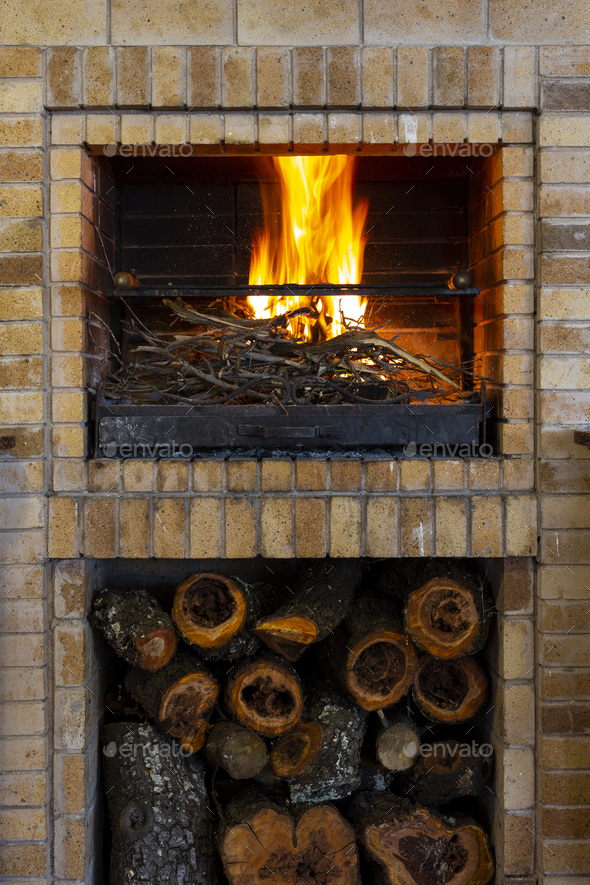 Closeup of fireplace bonfire in country house interior, cozy, place of ...