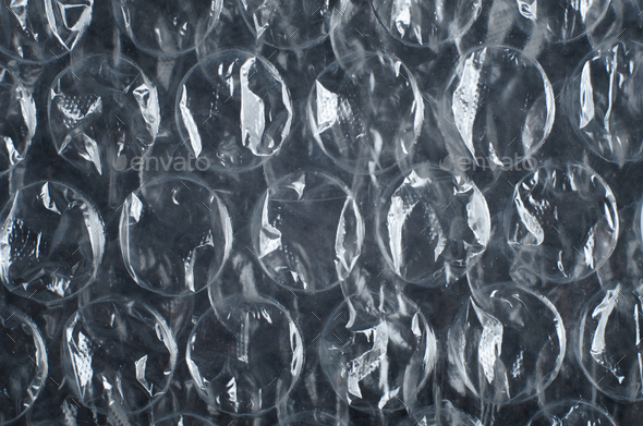 Bubble wrap film close-up, translucent polyethylene shockproof material ...