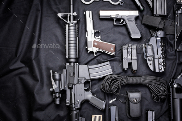 modern weapon, black background Stock Photo by FabrikaPhoto | PhotoDune