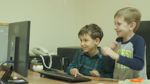Two Boys Working on Desktop Computer, Stock Footage | VideoHive