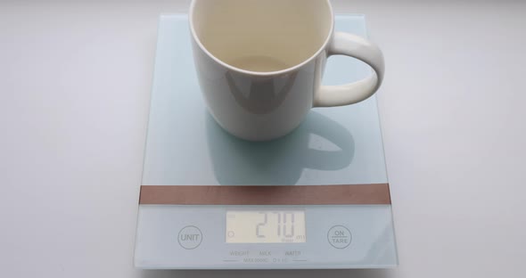 Weighing 200 Grams of Water on a Kitchen Scale, Stock Footage | VideoHive