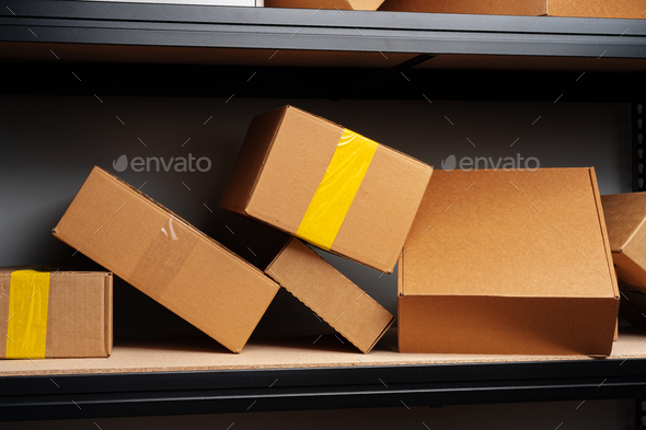 Rows of shelves with cardboard boxes in modern warehouse Stock Photo by ...