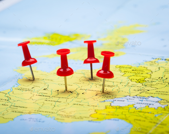 Travel destination points on a map indicated with colorful thumbtacks ...