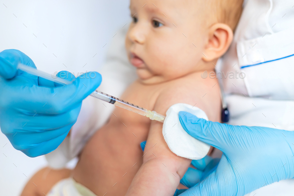 Vaccination baby, injection in the arm. Selective focus. Stock Photo by ...