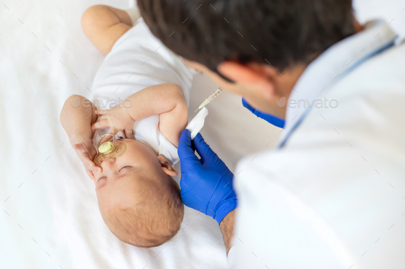 Vaccination baby, injection in the arm. Selective focus. Stock Photo by ...