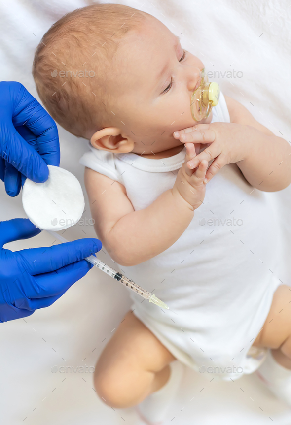 Vaccination baby, injection in the arm. Selective focus. Stock Photo by ...