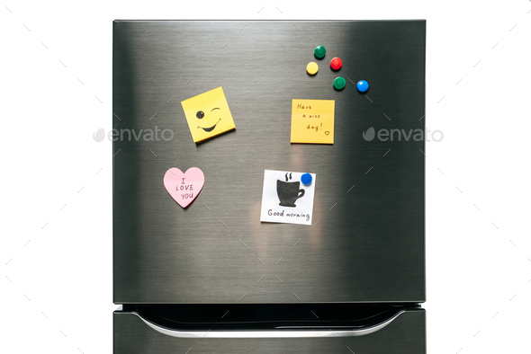 notes with wishes and magnets hanging on fridge isolated on white Stock ...