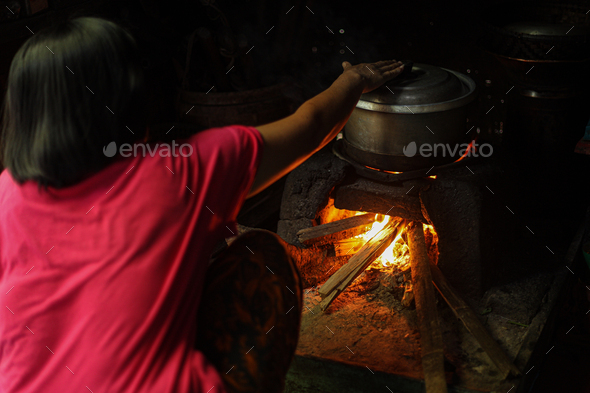 Country girl cooking in the traditional kitchen Stock Photo by Garakta ...