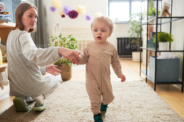 Child making his first steps Stock Photo by AnnaStills | PhotoDune
