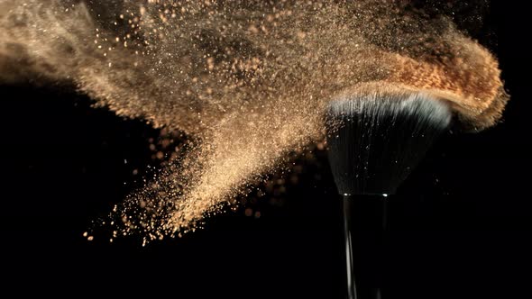 Super Slow Motion Shot of Makeup Powder Falling from Facial Brush at ...