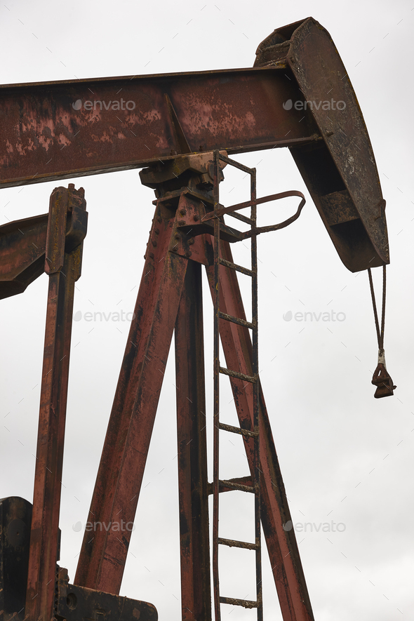 Rusty oil pumping machine. Pump jack in Ayoluengo, Burgos. Spain Stock ...