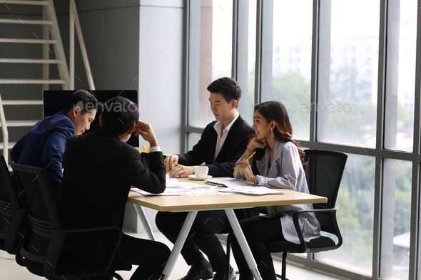Business Meeting Talking With Colleagues In Office Stock Photo by ...