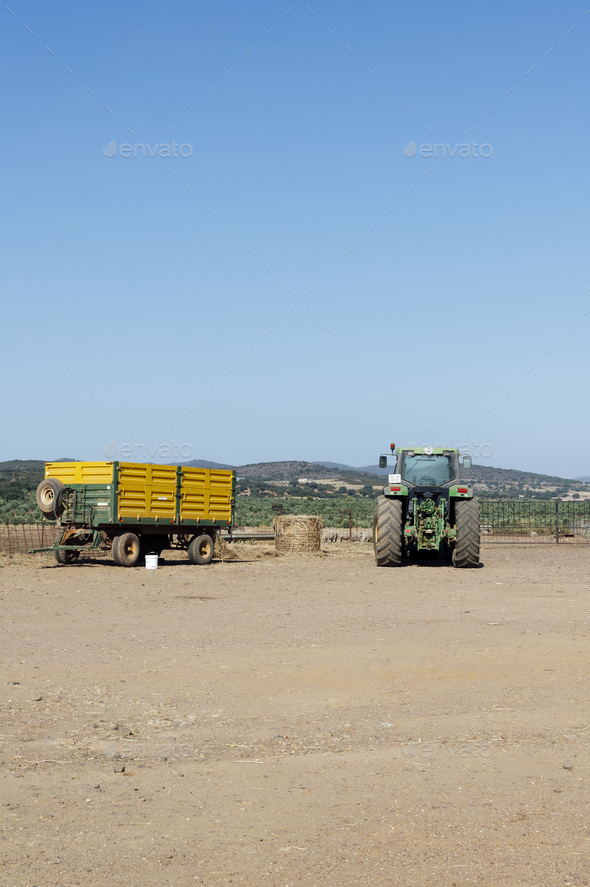 Views of a tractor and a trailer ready to work in the field Stock Photo ...