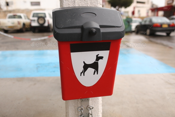 red box with packages for dogs poop outdoors Stock Photo by andriymedvediuk