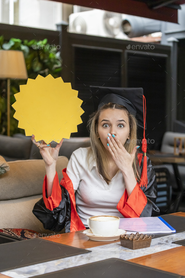 Cute shocked student wears cape and holding idea board Stock Photo by ...
