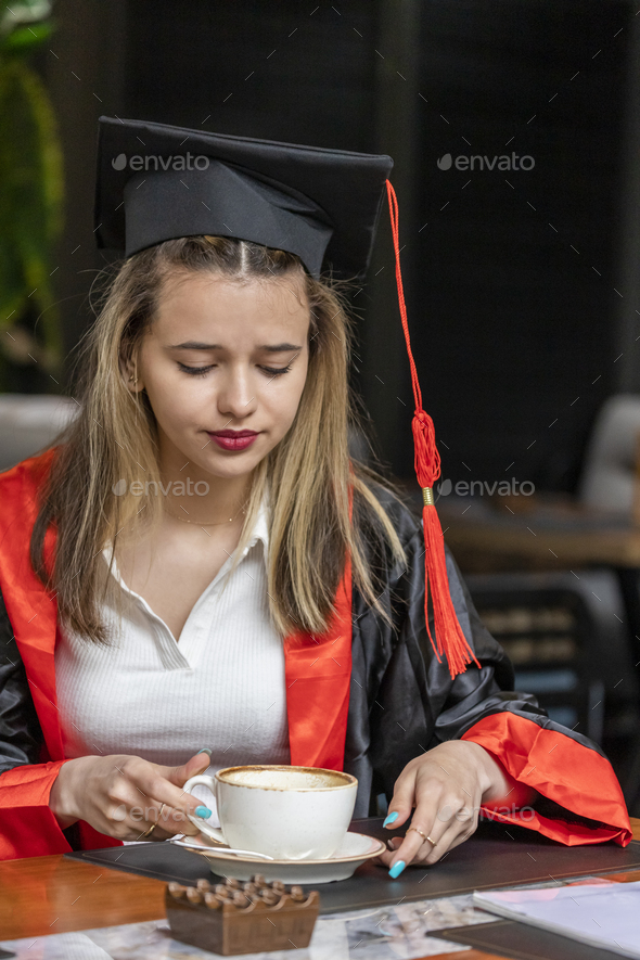 Vertical photo of young student drinking coffee at the restaurant Stock ...