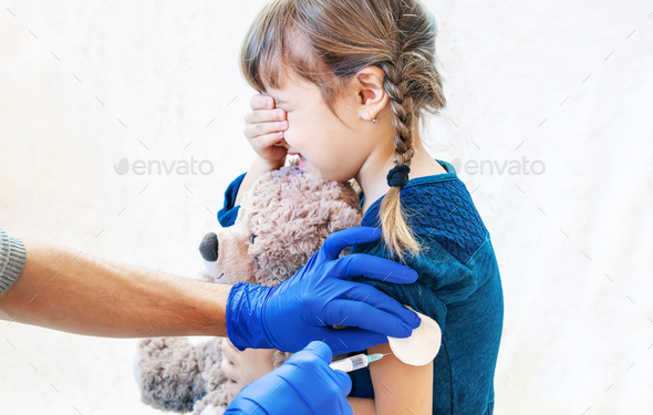 vaccination of children. An injection. Selective focus. Stock Photo by ...