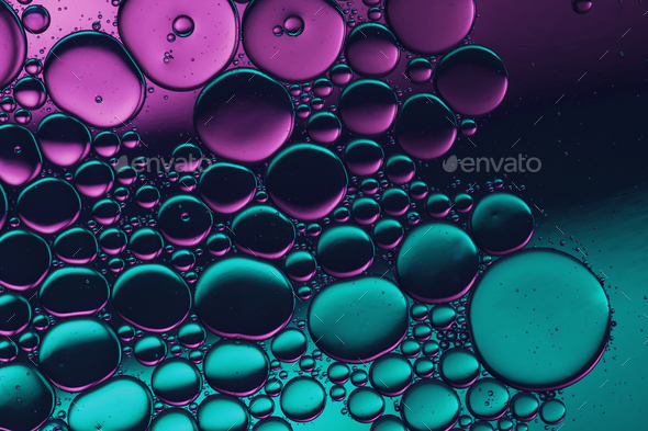 water drops on glass in colorful neon light Stock Photo by andreiuc88