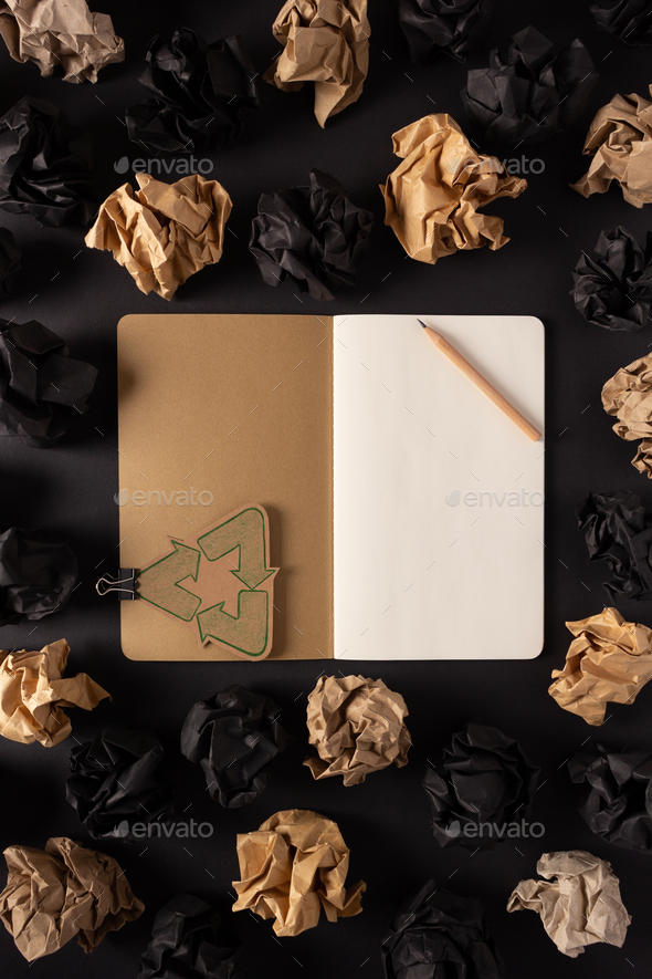 Notepad or notebook and crumpled paper balls at background texture ...