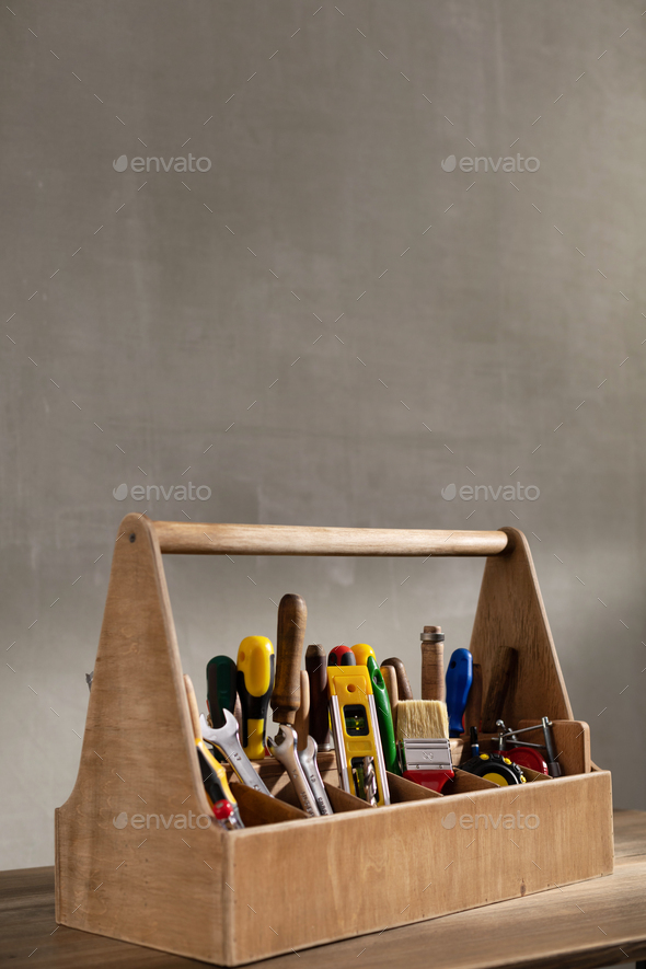 Construction tools and toolbox at wooden table background texture ...