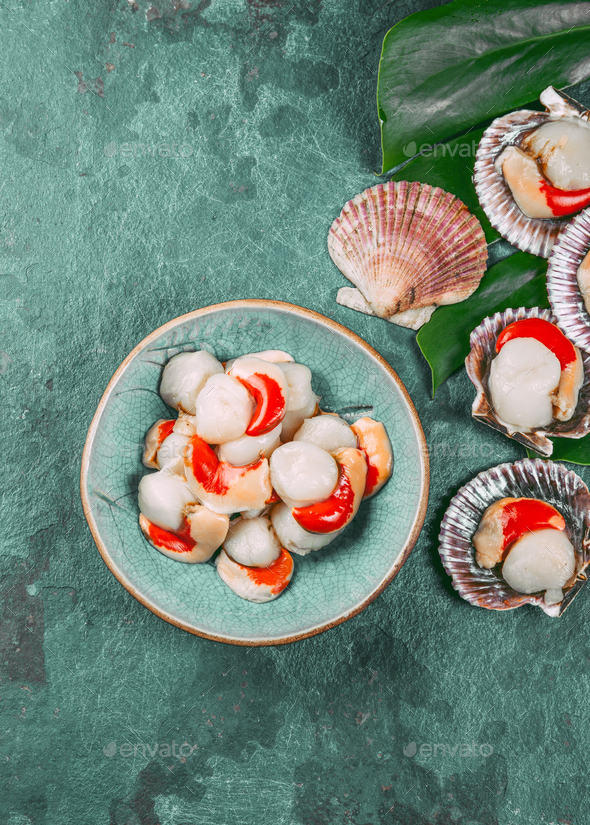 Raw fresh seafood shellfish scallops on blue background Stock Photo by ...