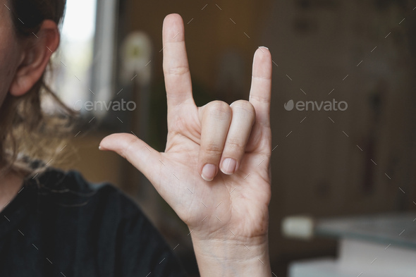 Female hand doing the word love in sign language Stock Photo by nanihta