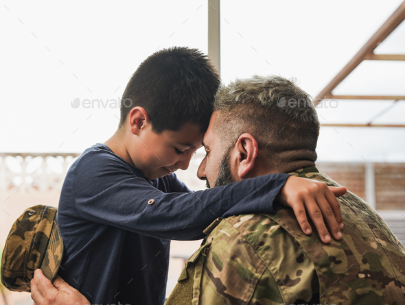 Military soldier man hugging his son at home - Father and child love ...