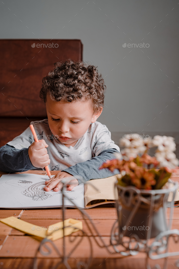 Boy painting his favorite character in the picture book Stock Photo by ...