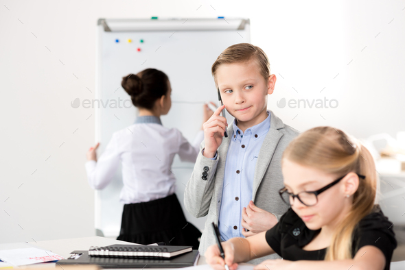 Children working in office like adult business people Stock Photo by ...