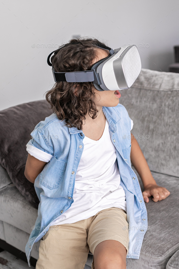 happy little boy child using virtual reality headset vr glasses ...