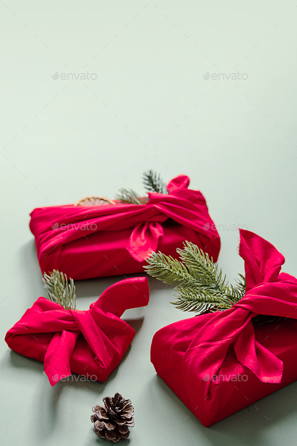 Christmas Presents Wrapped in Fabric. Stock Photo by zhenny-zhenny