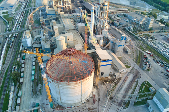 Aerial view of cement factory under construction with high concrete ...