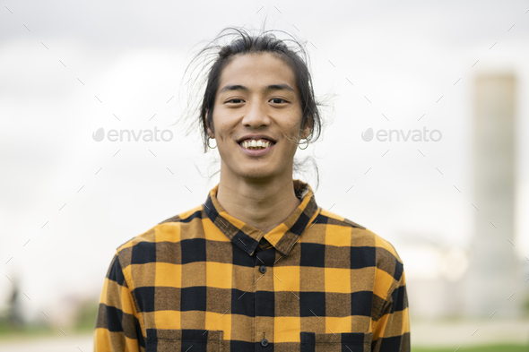 portrait of a young asian filipino man smiling at camera outdoors Stock ...
