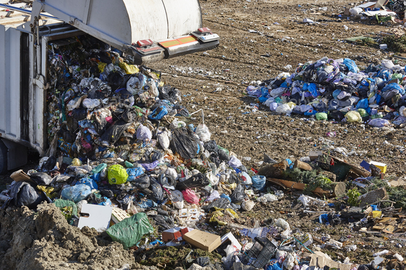 Truck unloading garbage on an open air dump. Waste recycling Stock ...
