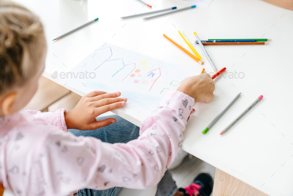 White girl drawing during class in art school indoors Stock Photo by ...
