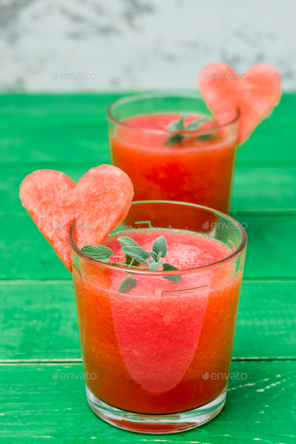 Fresh watermelon blended drink with mint leaves and a heart of ...