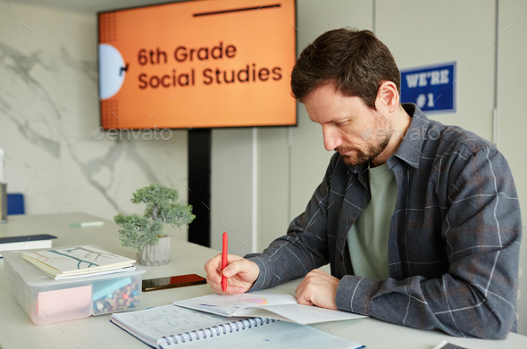 Teacher Grading Tests in School Stock Photo by seventyfourimages ...