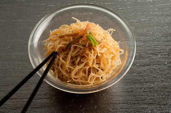 china spaghetti over black background Stock Photo by MarcoMayer | PhotoDune