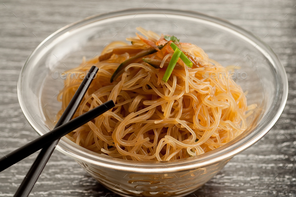 china spaghetti over black background Stock Photo by MarcoMayer | PhotoDune
