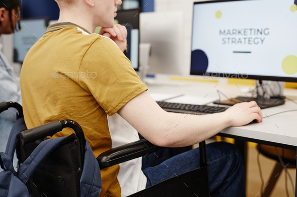 Student with Disability using Computer Stock Photo by seventyfourimages