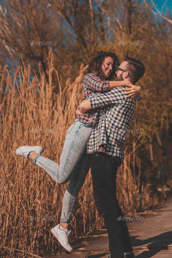 Couple hugging and spinning around Stock Photo by Impactphotography