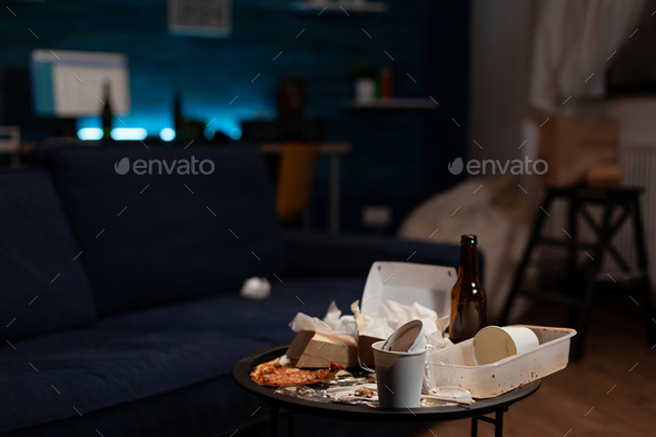 Nobody in messy home space with dirty food garbage on untidy table ...