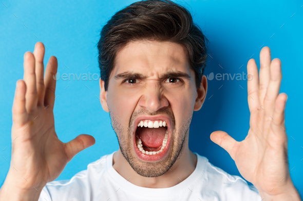 Headshot of man showing anger and frustration, yelling with outraged ...