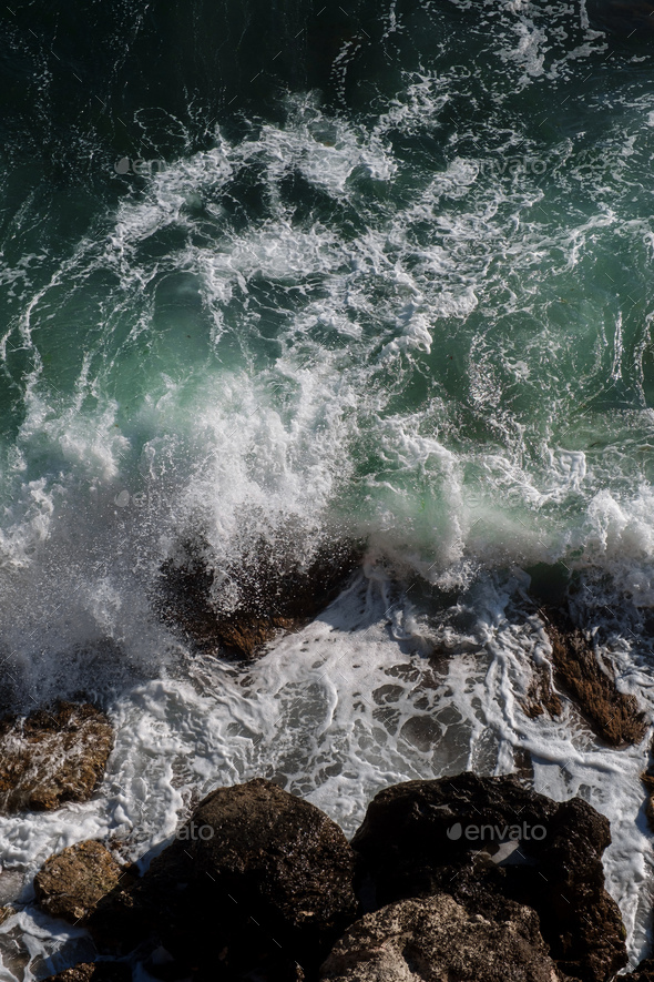 Ocean wave background breaking sea water rocky shore Stock Photo by ...