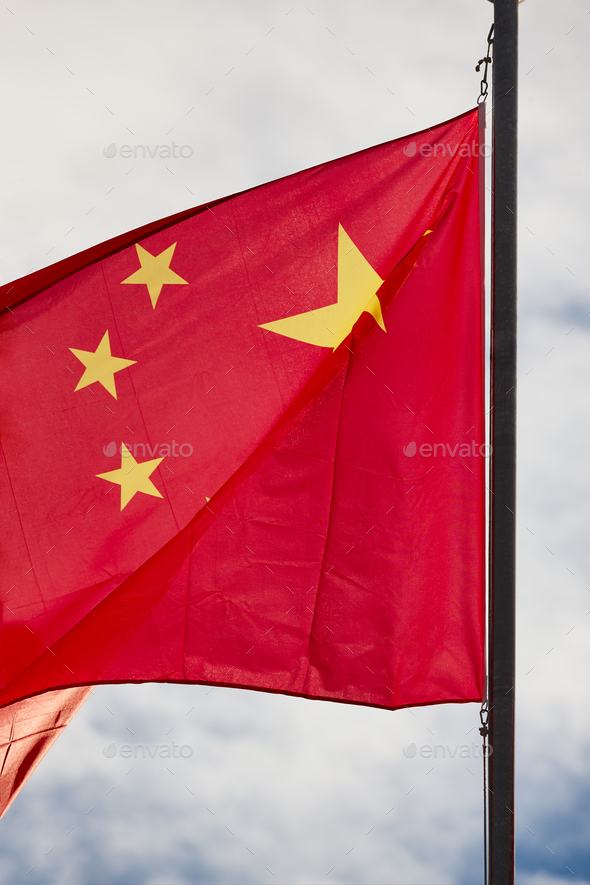 China flag waving over a blue sky. Chinese national emblem Stock Photo ...