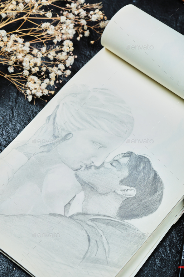 Drawing of men on the notebook in the dark background Stock Photo by ...