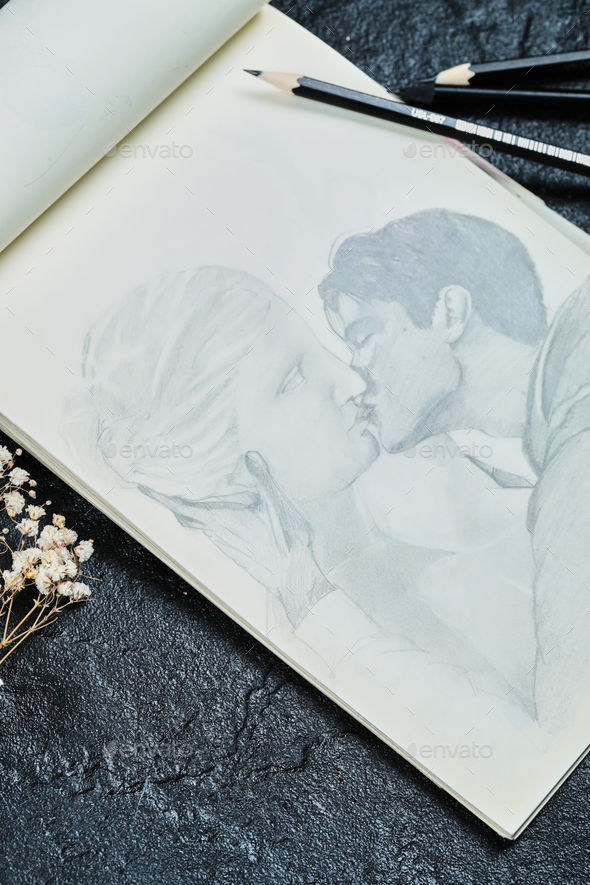 Drawing of men on the notebook in the dark background Stock Photo by ...