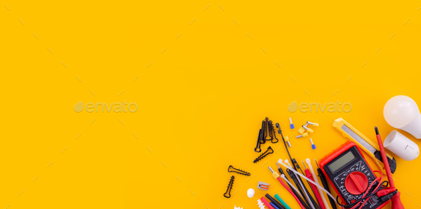 Electrical installation measuring instruments tools on a yellow ...