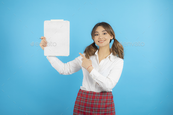 Confidence beautiful college girl shoving her notes and point finger on ...