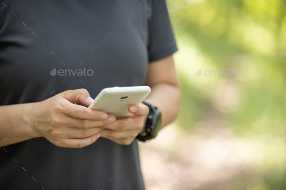 Hands using mobile phone in summer forest Stock Photo by lzf | PhotoDune